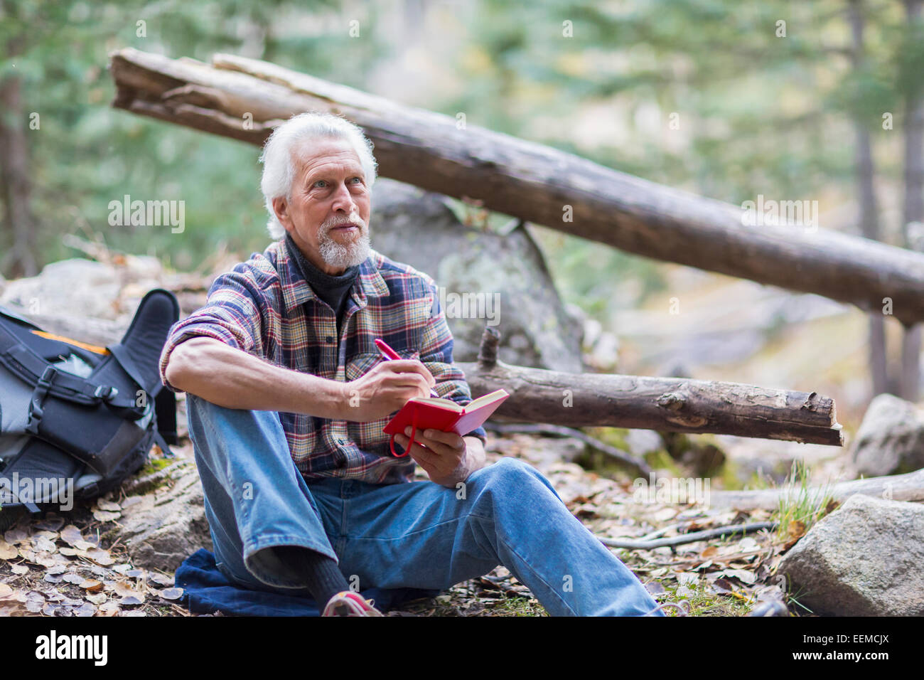Caucasian hiker writing in forest Stock Photo - Alamy