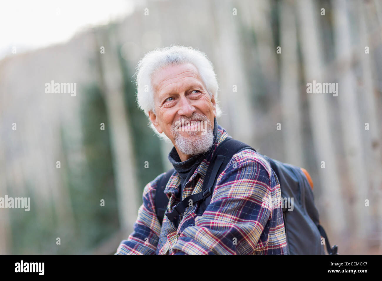 Caucasian hiker smiling in forest Stock Photo - Alamy