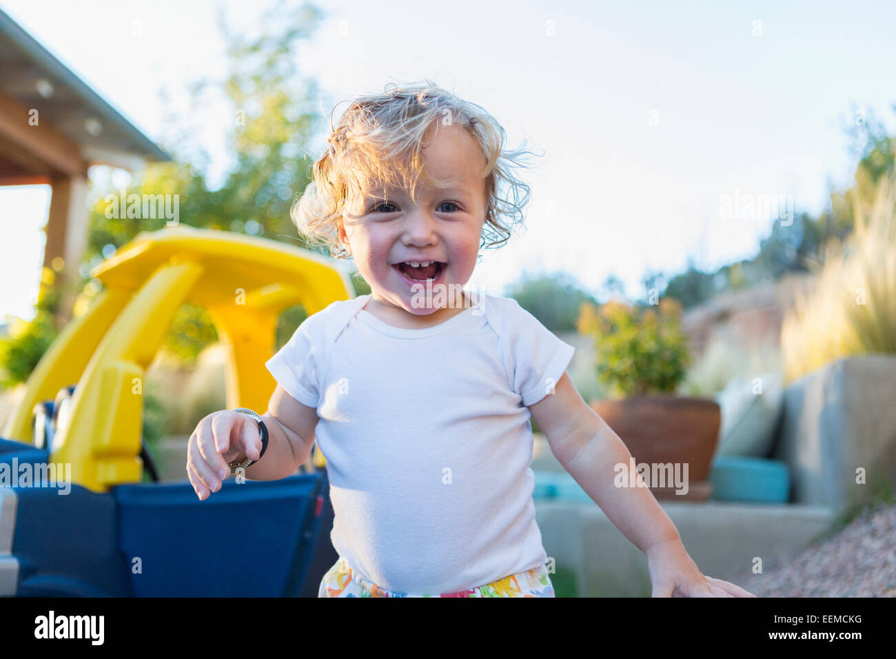 Caucasian boy laughing in backyard Stock Photo - Alamy
