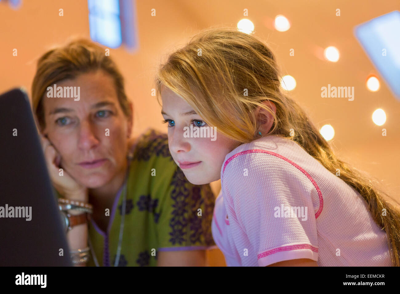 Caucasian mother and daughter using computer together Stock Photo - Alamy