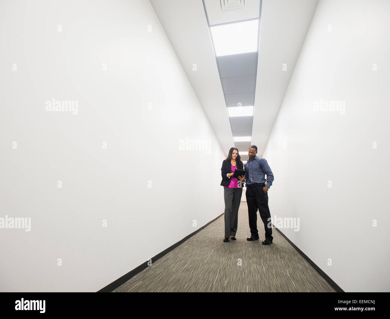 Business people in corridor standing hi-res stock photography and ...