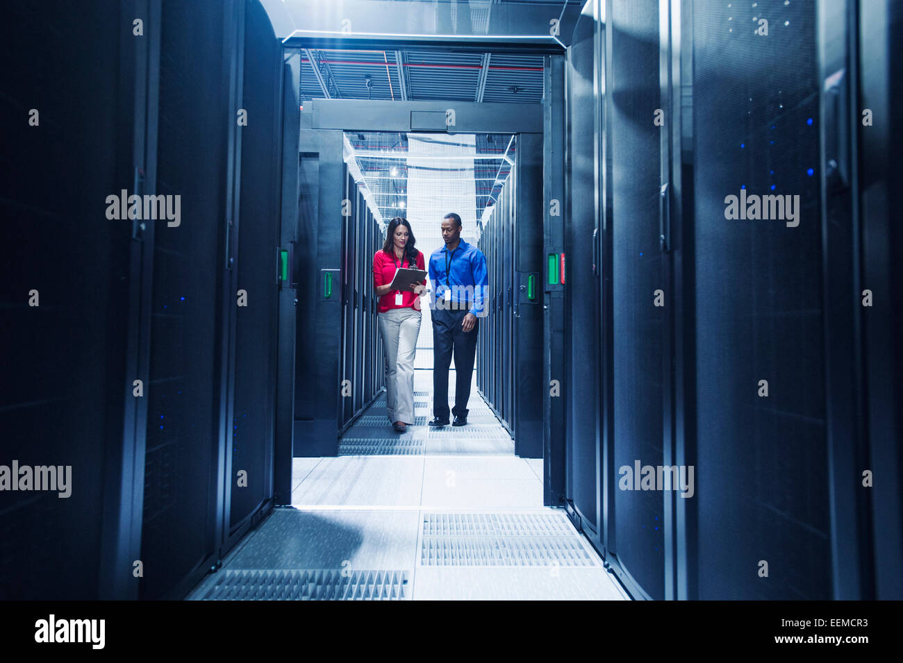 Woman walking into room full of people hi-res stock photography and ...