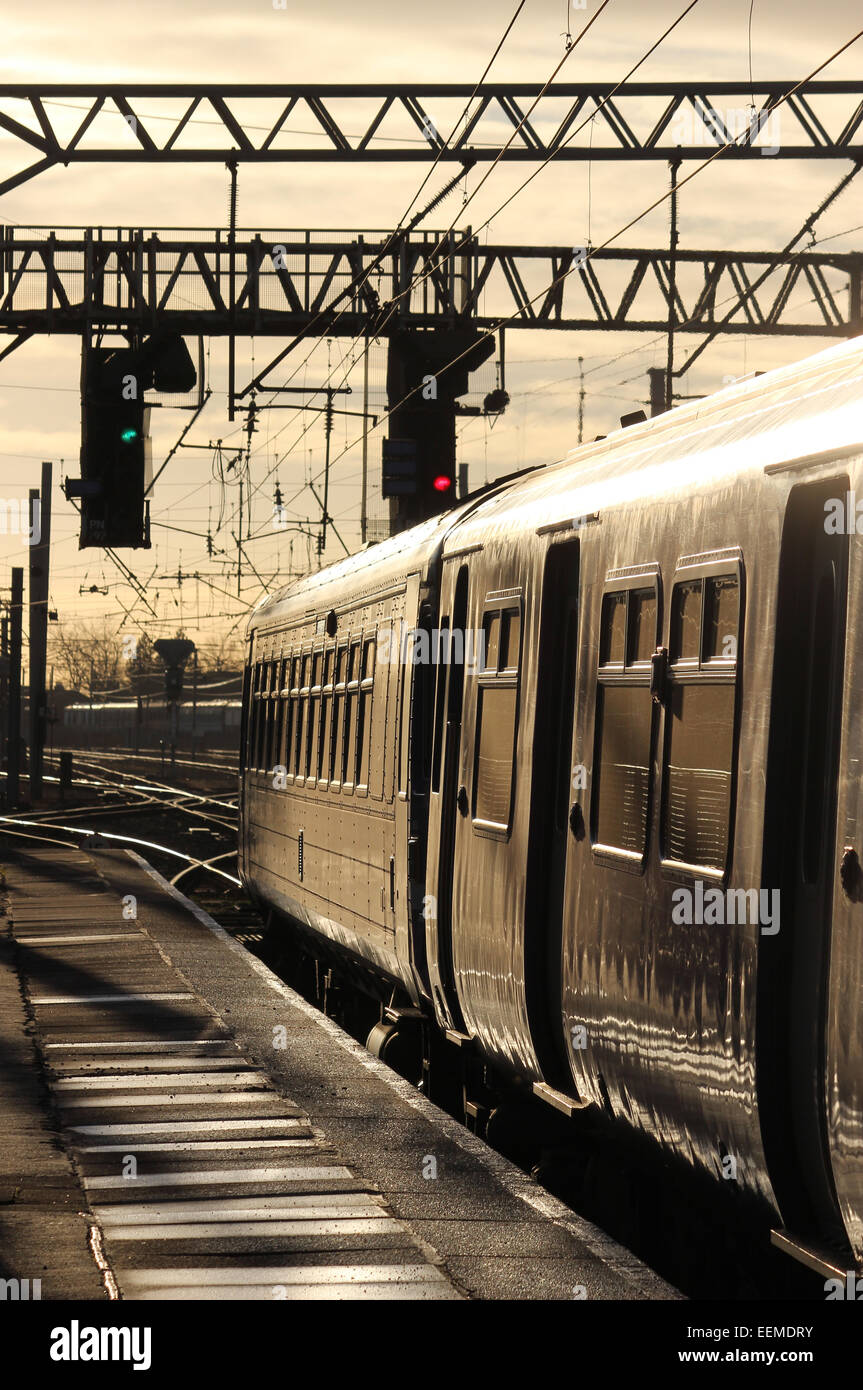 Leeds to Morecambe train departing from platform 1 at Carnforth station ...