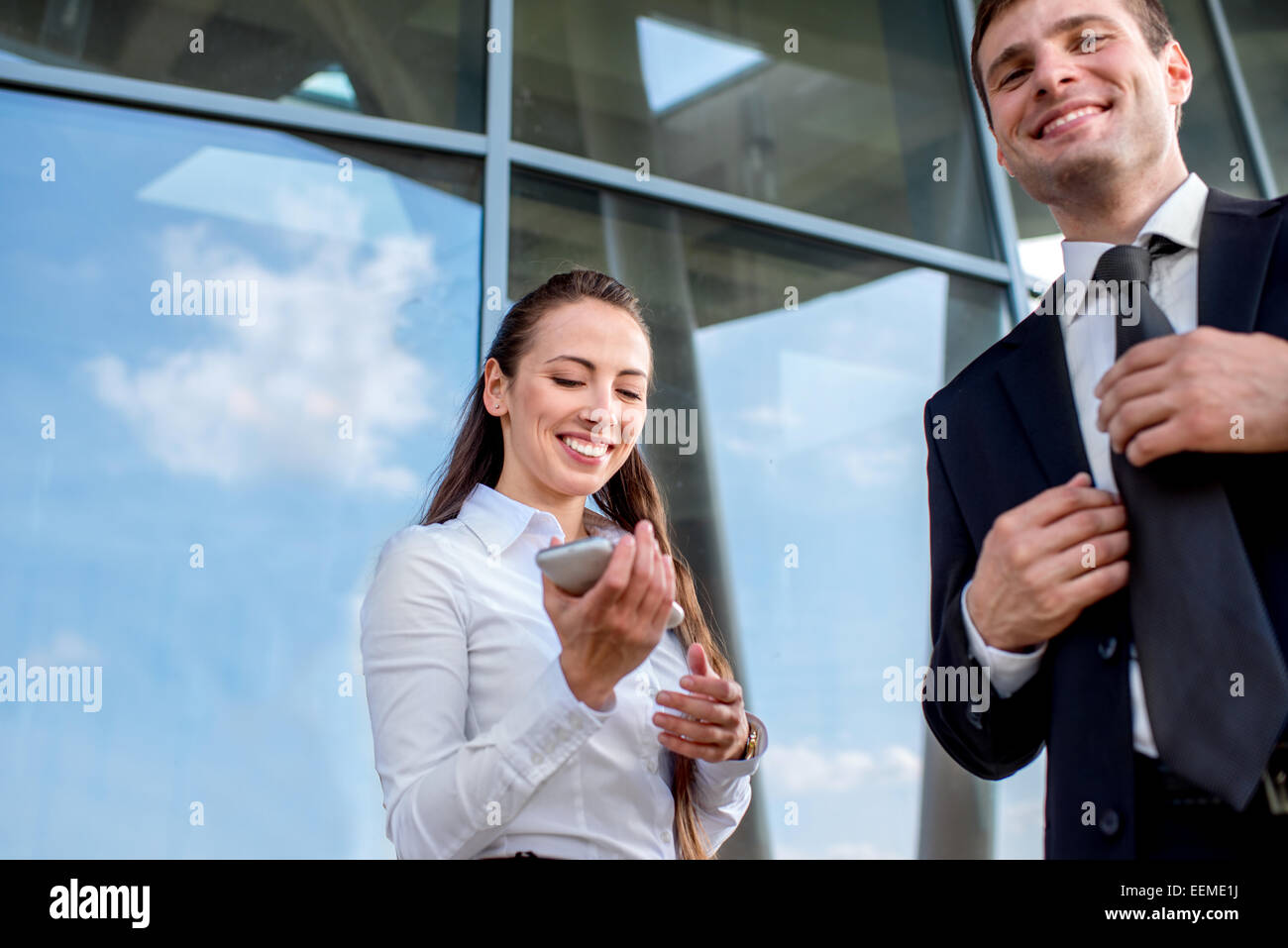 Young Business couple working outdoors near the office Stock Photo - Alamy