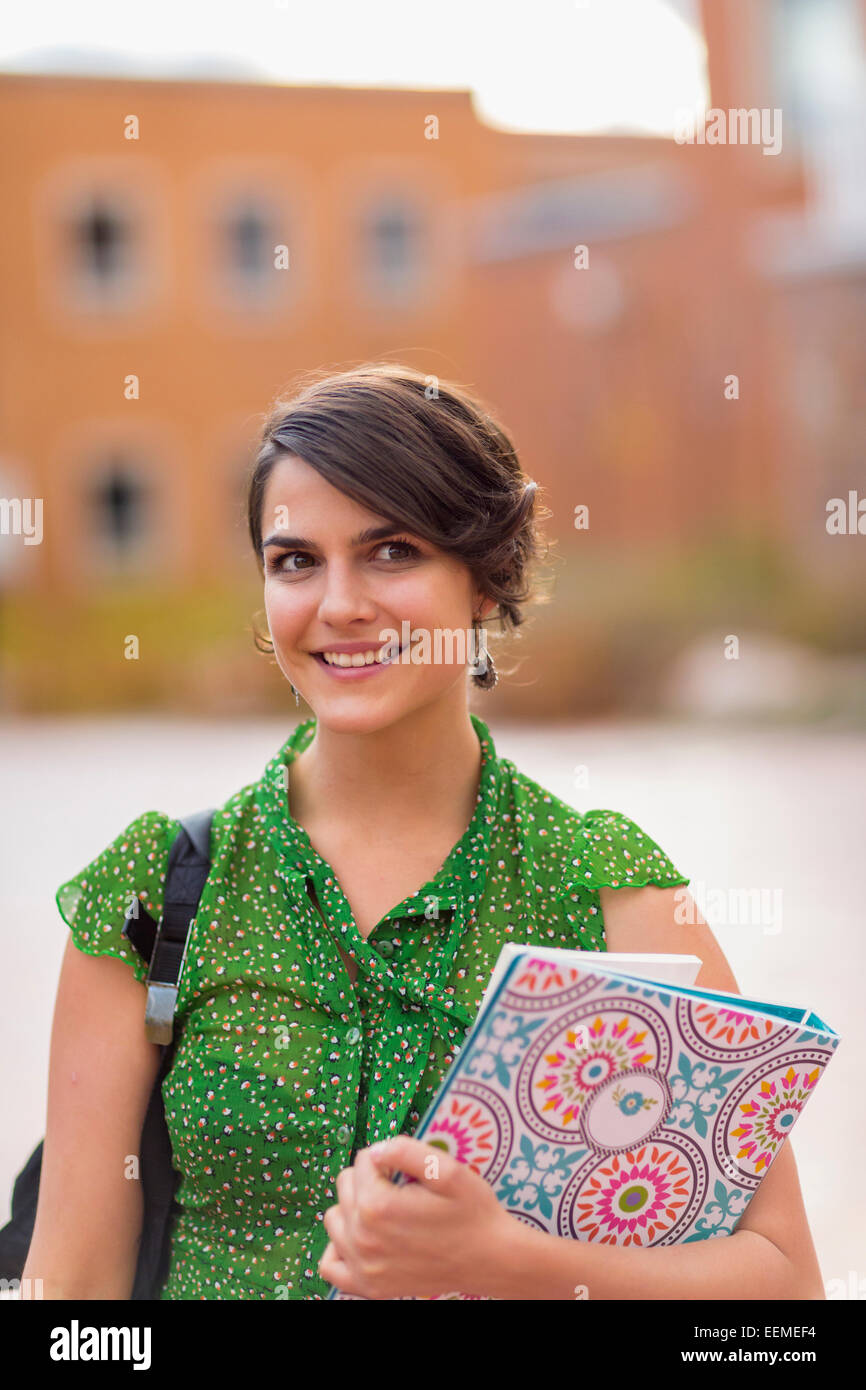 College student carrying books hi-res stock photography and images - Alamy