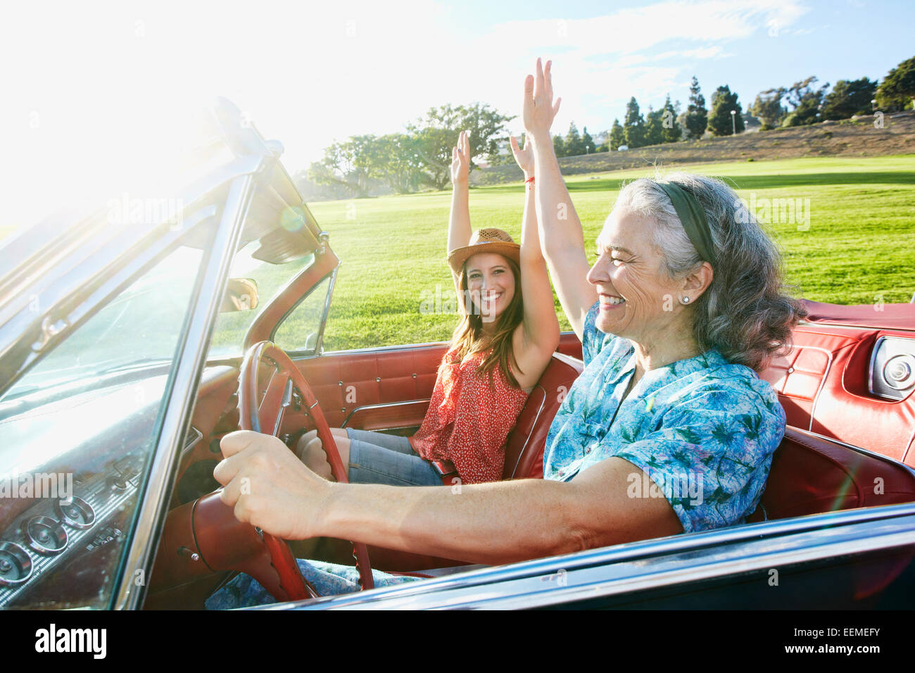 Mother and daughter driving in classic convertible Stock Photo - Alamy