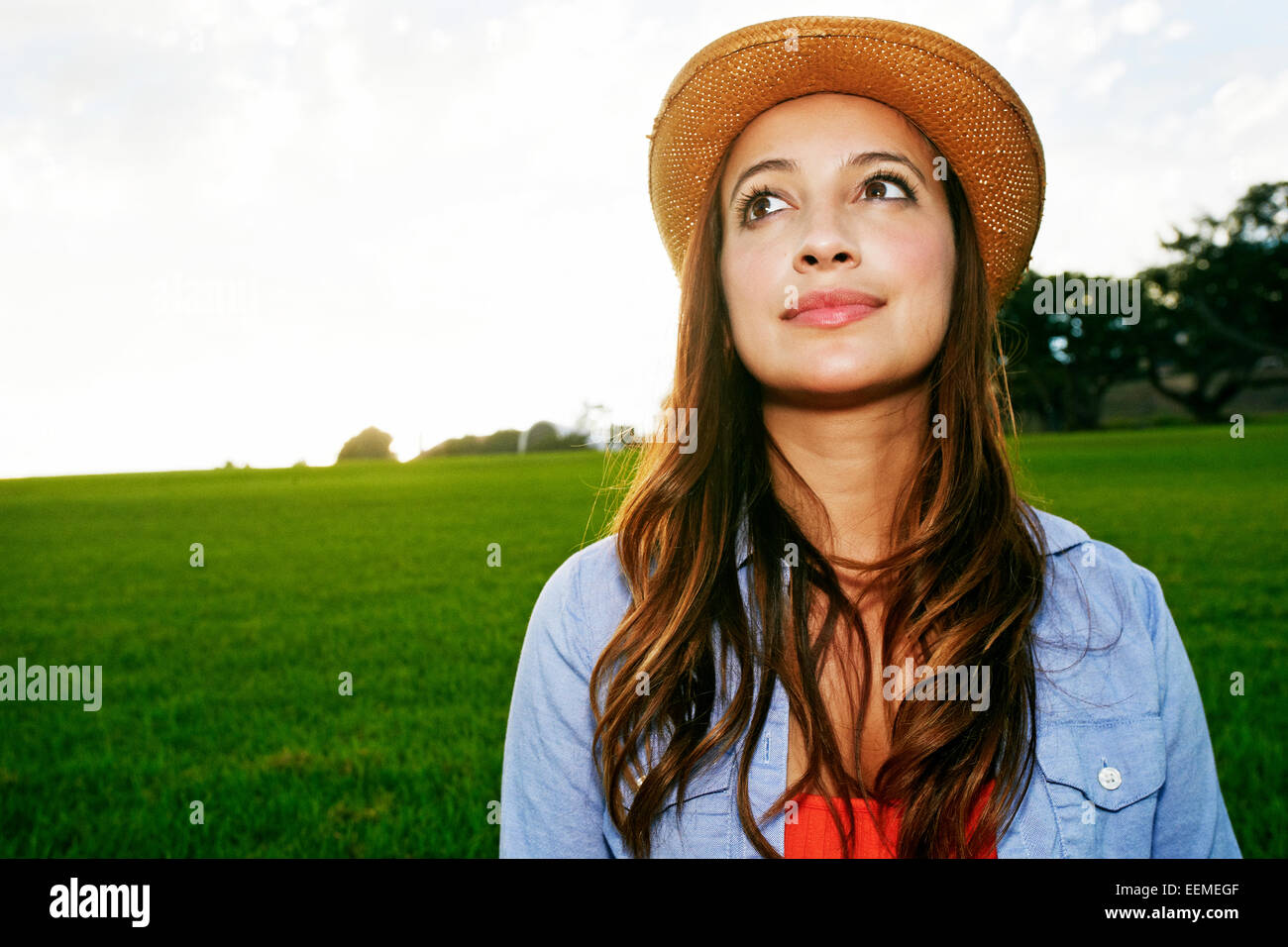 Woman smiling outdoors in field hi-res stock photography and images - Alamy
