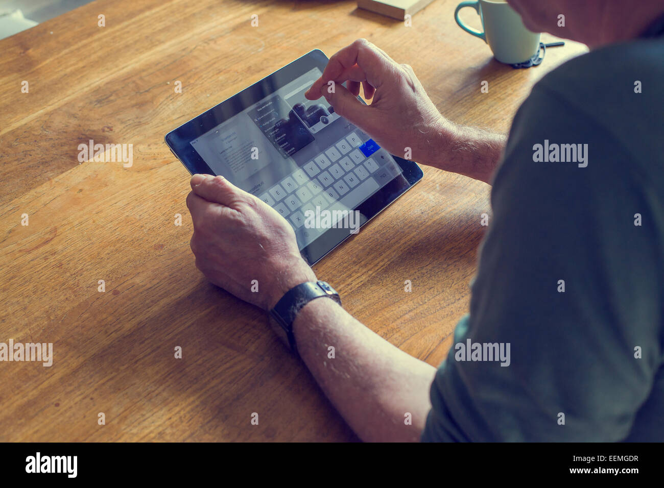 Man working with tablet Stock Photo - Alamy
