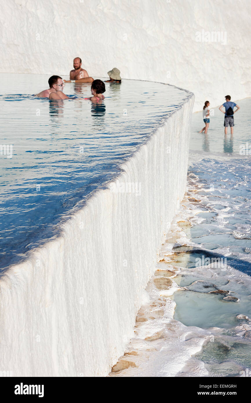 People bathing in a pool on travertine terraces of Pamukkale. Denizli ...