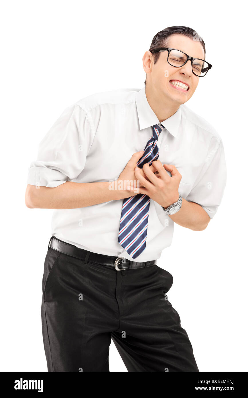 Young man experiencing a heart attack isolated on white background ...