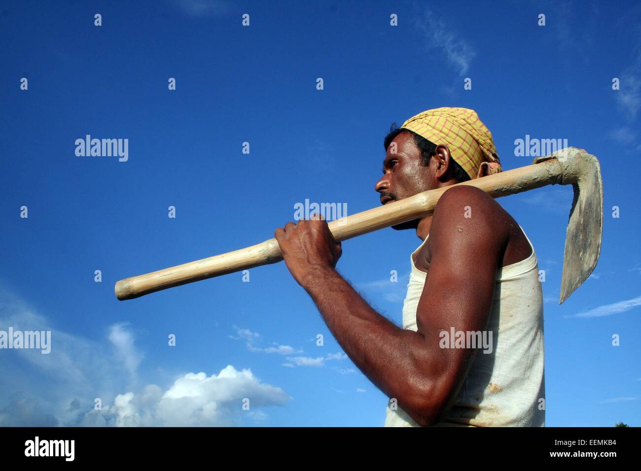 Bangladesh 10 January 2015. Farmer using cell phone Stock Photo - Alamy