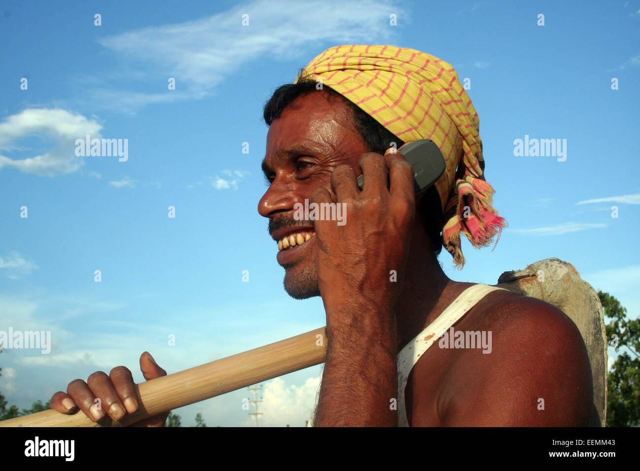 Bangladesh 10 January 2015. Farmer using cell phone Stock Photo - Alamy