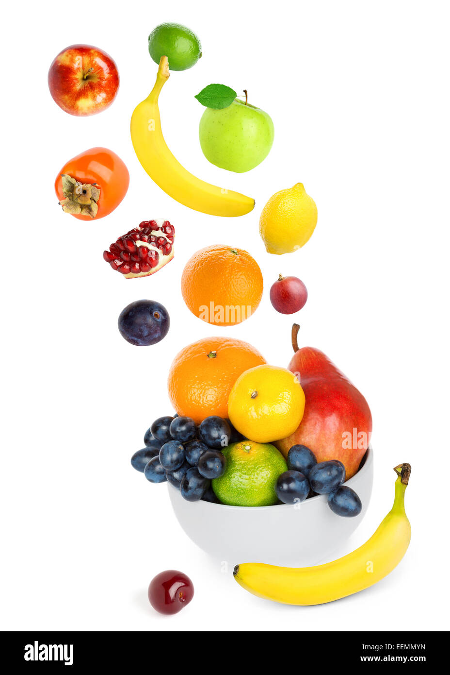 Falling fresh color fruits on white background Stock Photo - Alamy