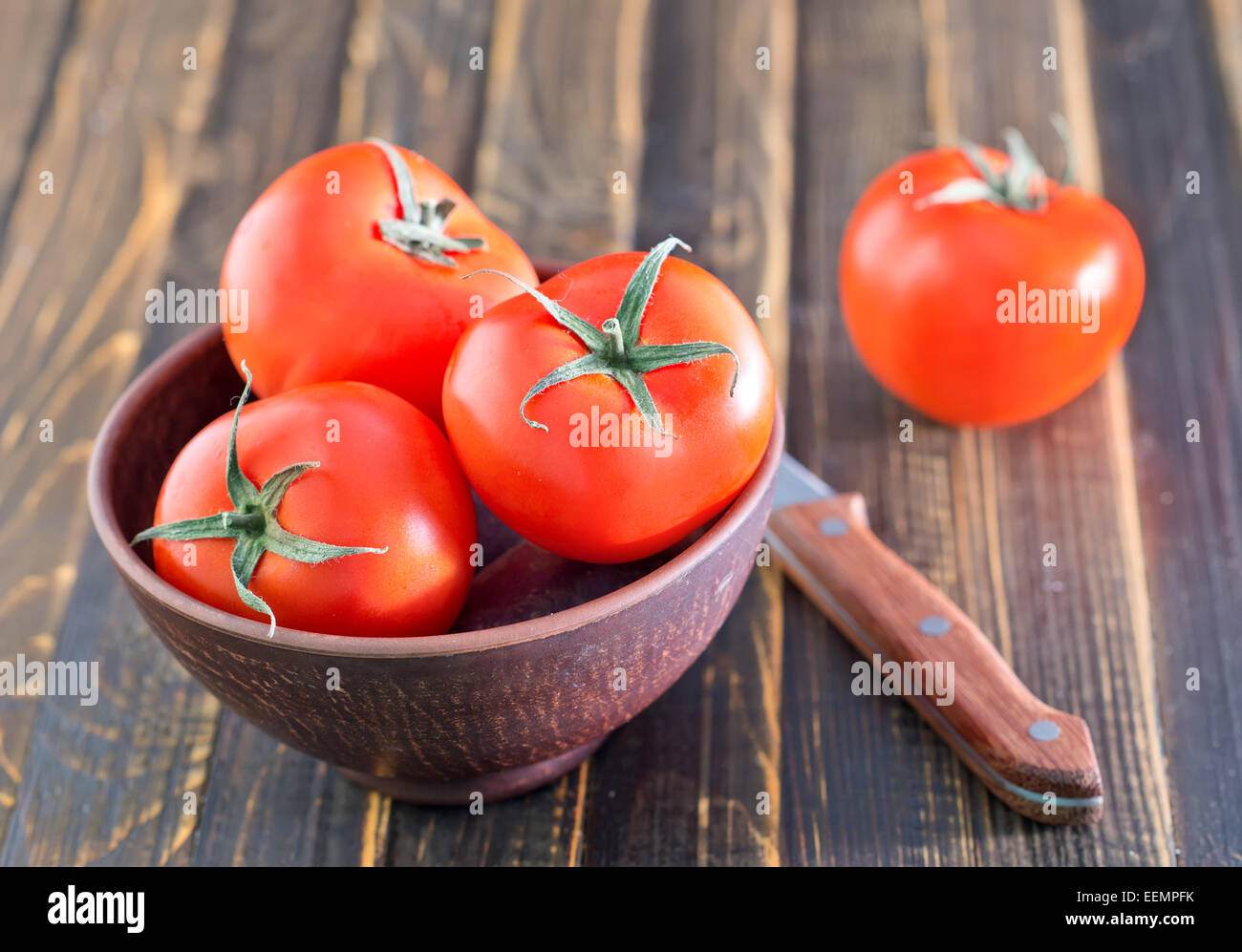 tomato on board and on a table Stock Photo - Alamy