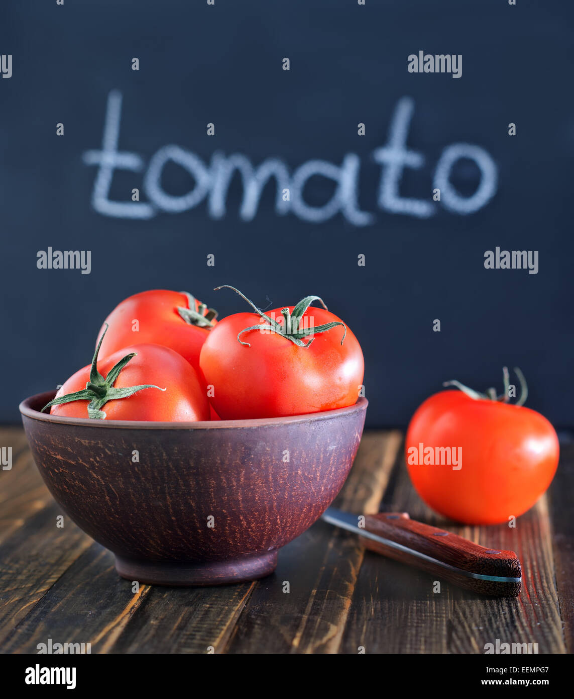 tomato on board and on a table Stock Photo - Alamy