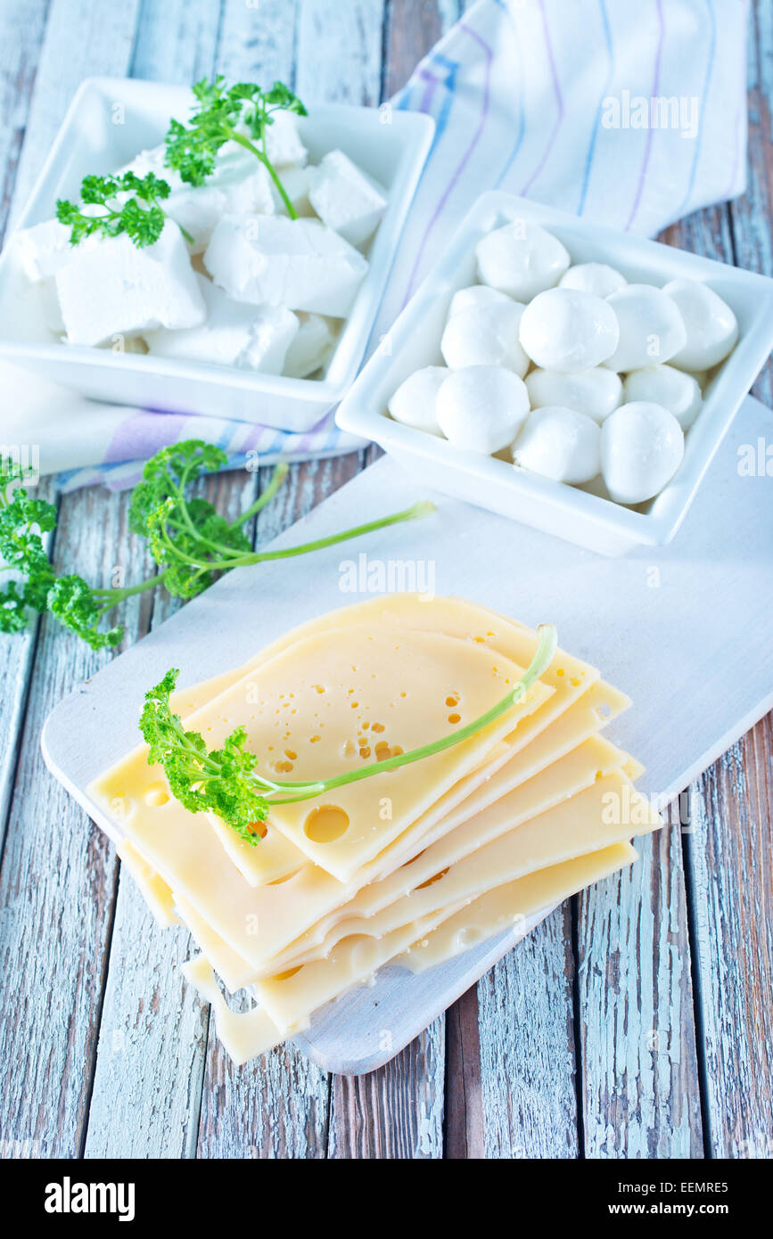 cheese on board and on a table Stock Photo - Alamy