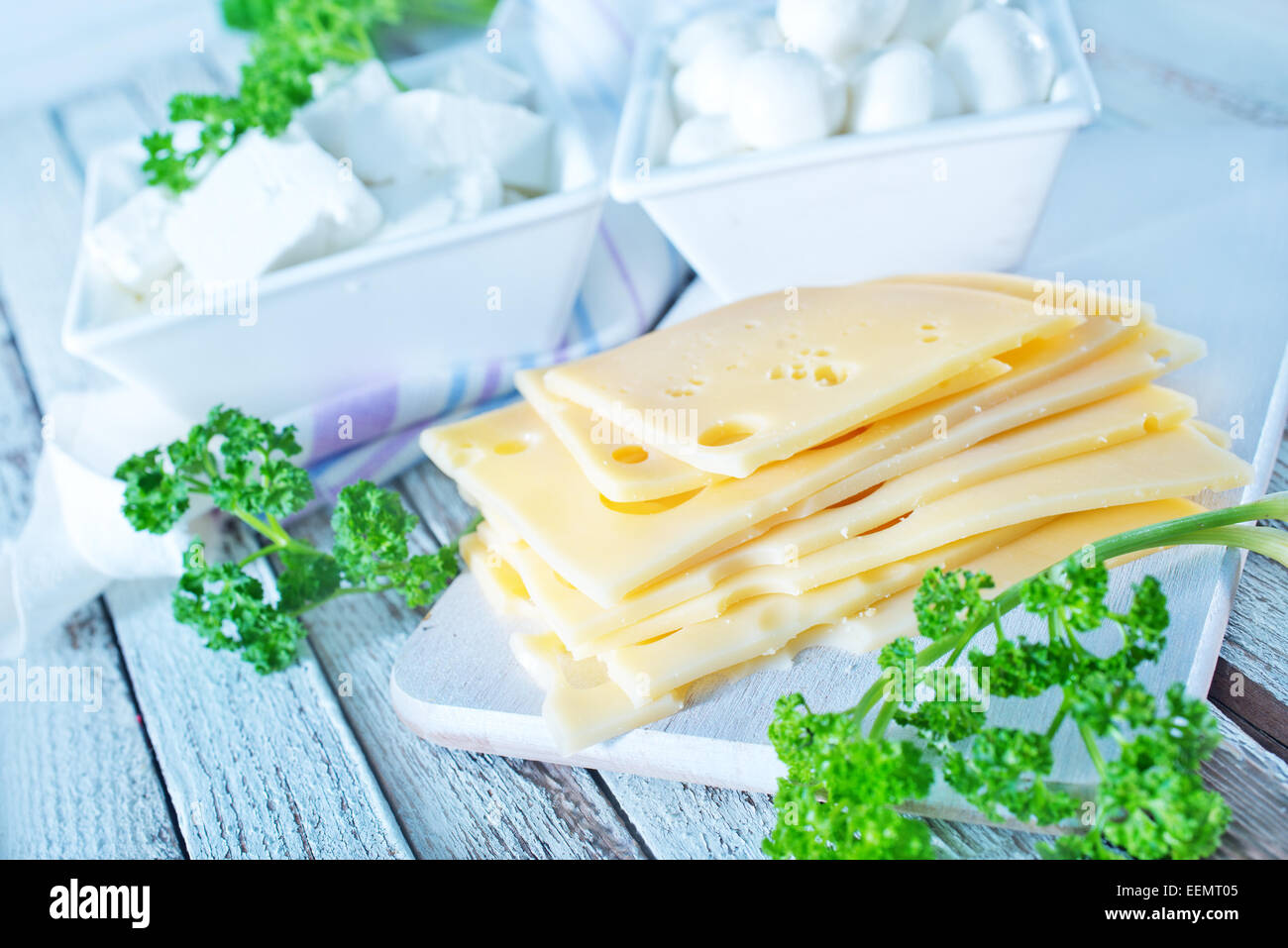 cheese on board and on a table Stock Photo - Alamy