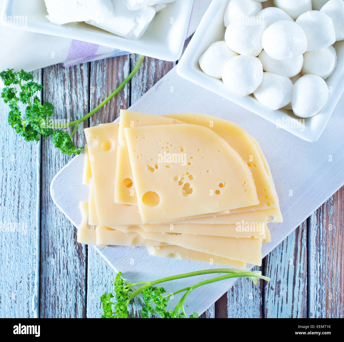 cheese on board and on a table Stock Photo - Alamy