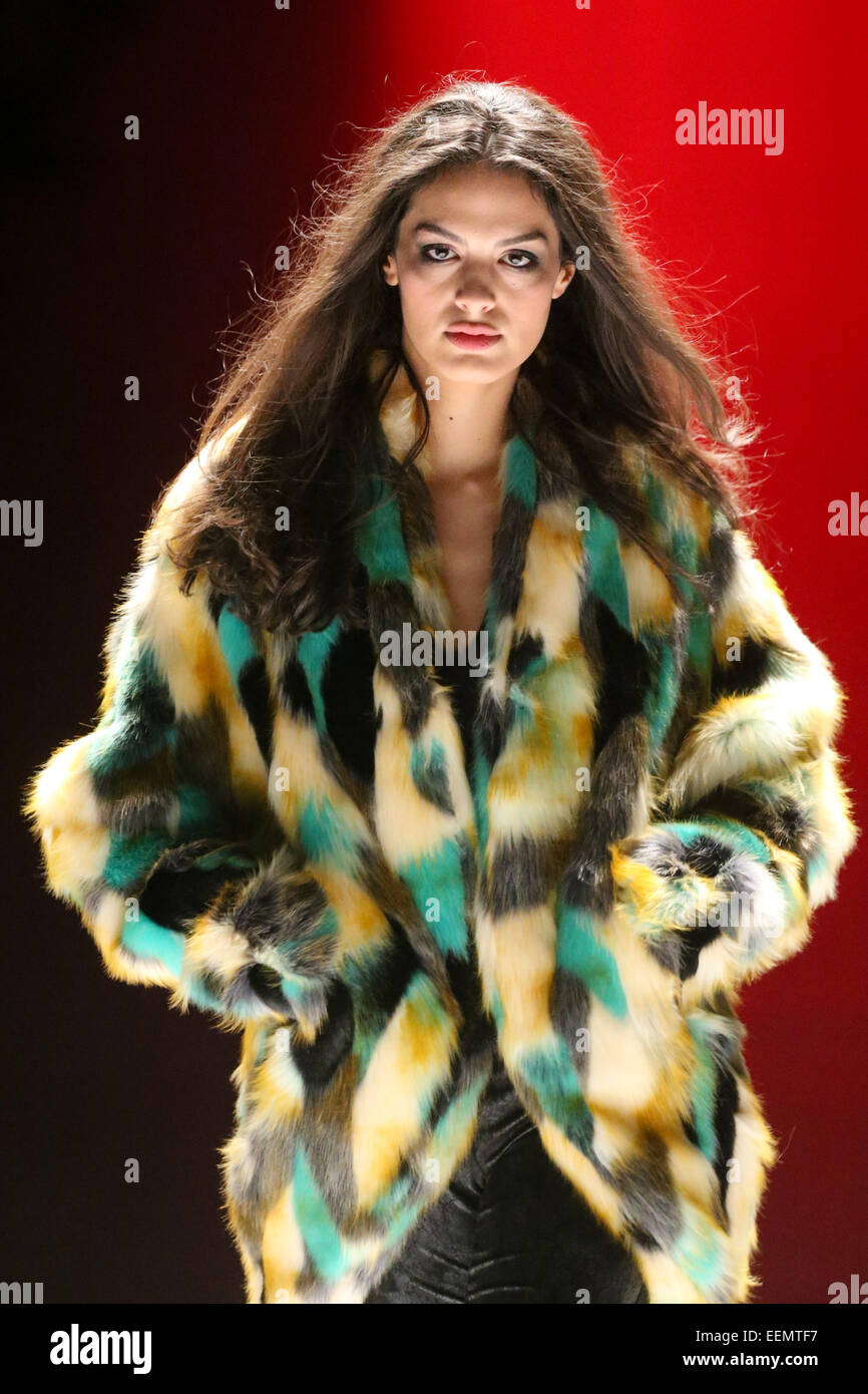 Berlin, Germany. 20th Jan, 2015. A model displays a creation of German ...
