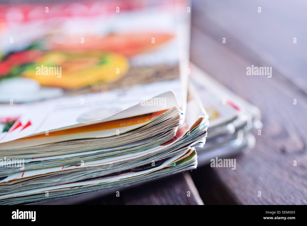 stack of magazines on the wooden table Stock Photo - Alamy