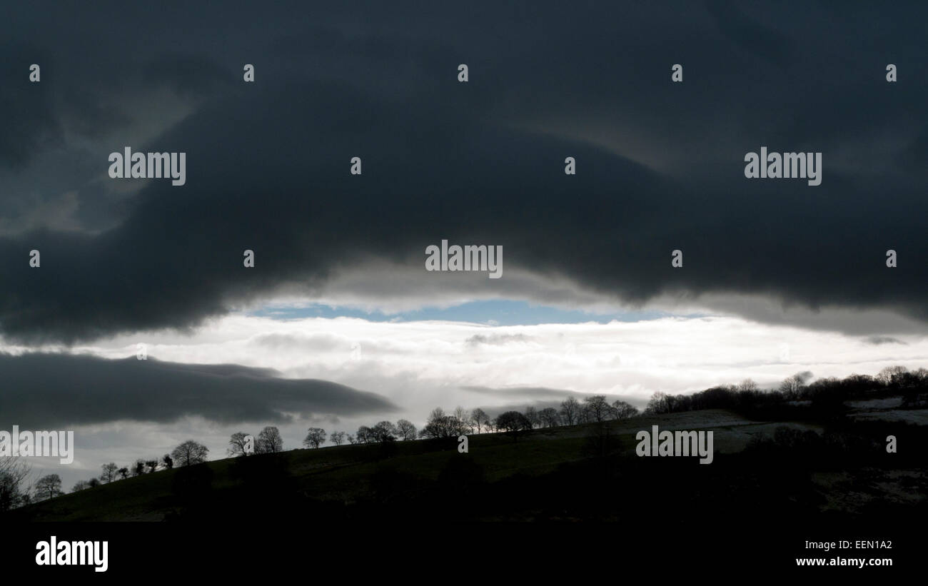 Dark sky with ominous black clouds portending rain, sleet or snow at ...