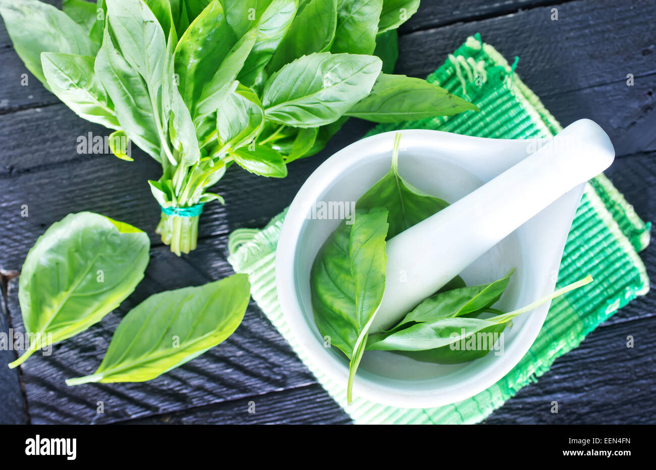 fresh basil in bowl and on a table Stock Photo - Alamy