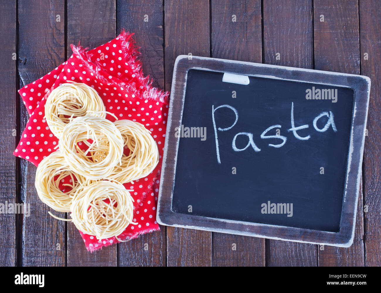 raw pasta and black board for menu and recipe Stock Photo - Alamy