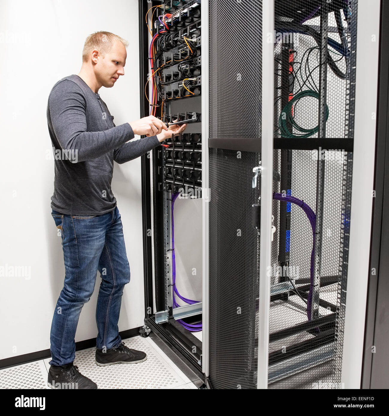 IT consultant building network rack in datacenter Stock Photo - Alamy