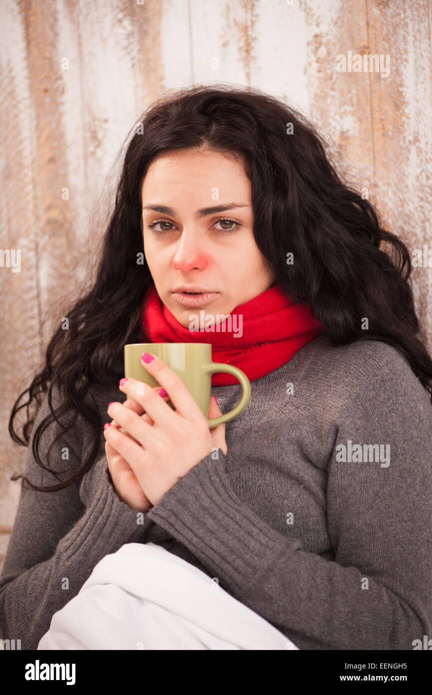 Frustrated sick girl with cup Stock Photo - Alamy