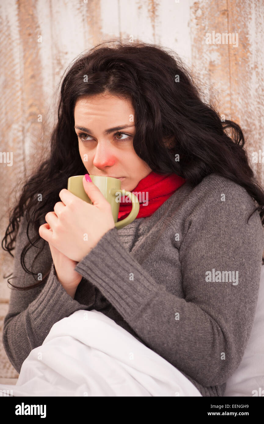 Frustrated sick girl with cup Stock Photo - Alamy