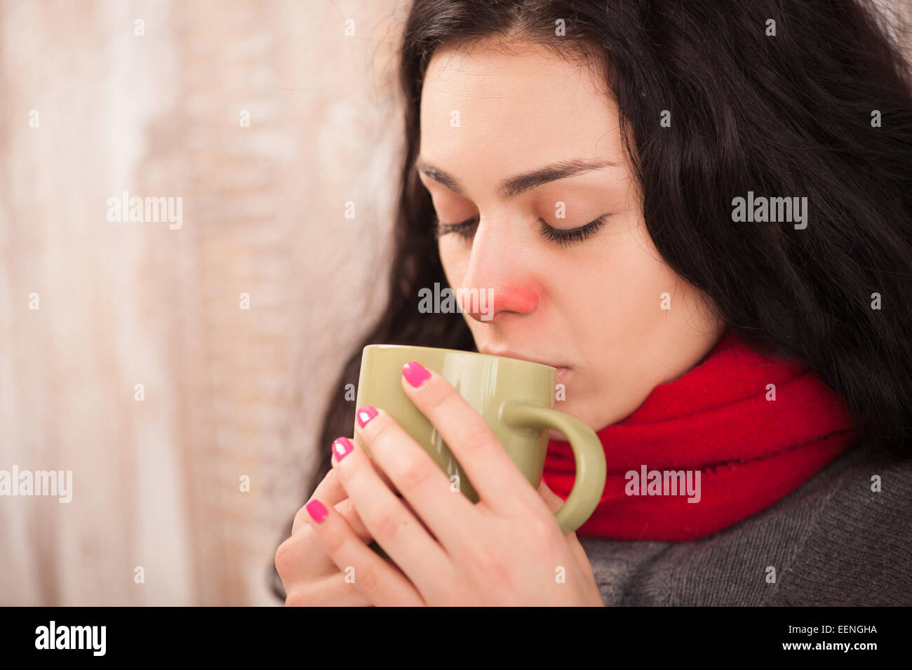 Frustrated sick girl with cup Stock Photo - Alamy
