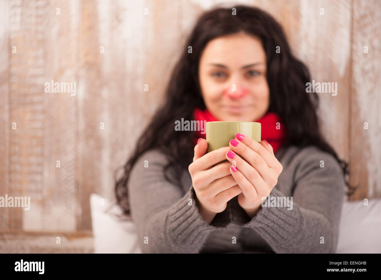 Frustrated sick girl with cup Stock Photo - Alamy