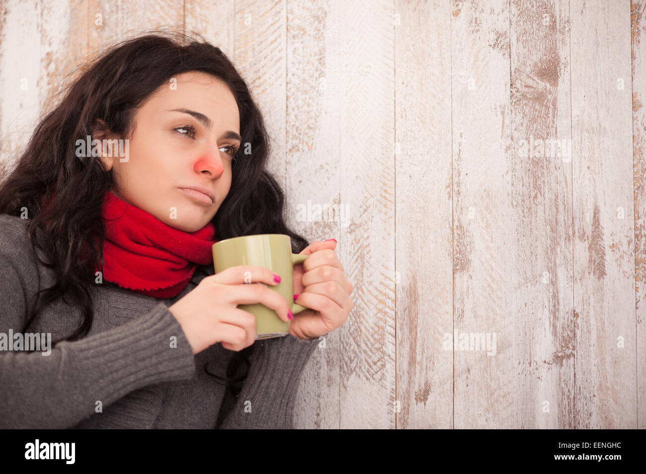 Frustrated sick girl with cup Stock Photo - Alamy