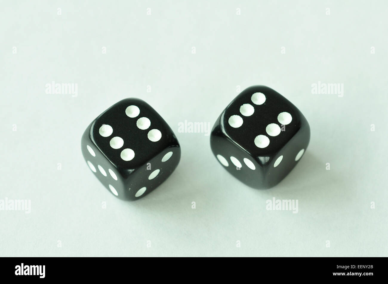 Two die showing the lucky six Stock Photo - Alamy