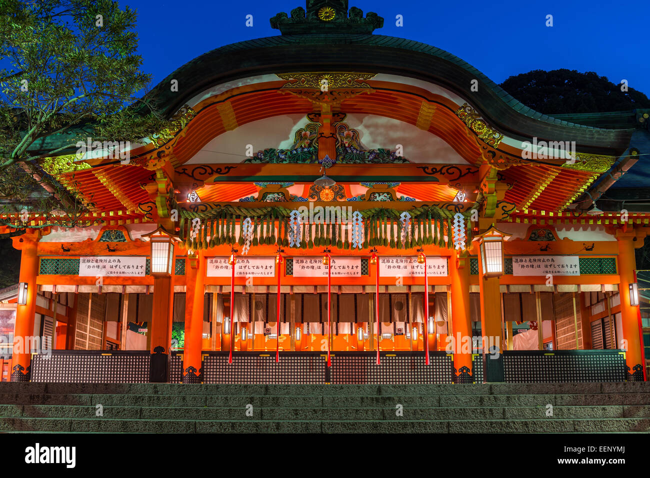 The haiden, or the hall of worship, of Fushimi Inari shrine lit up in ...