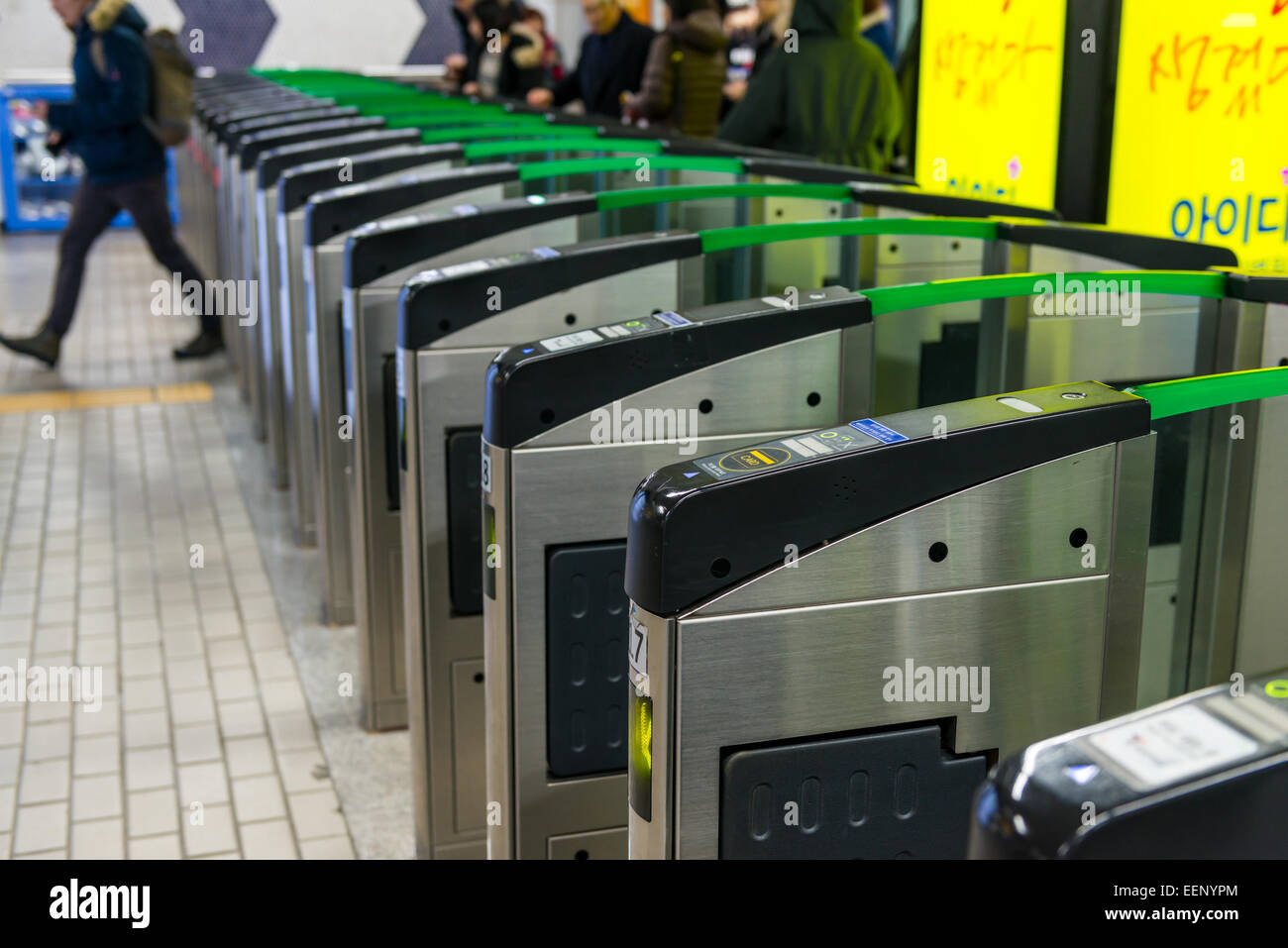 Local Seoulites swipe their metro cards at Gangnam Station on December ...