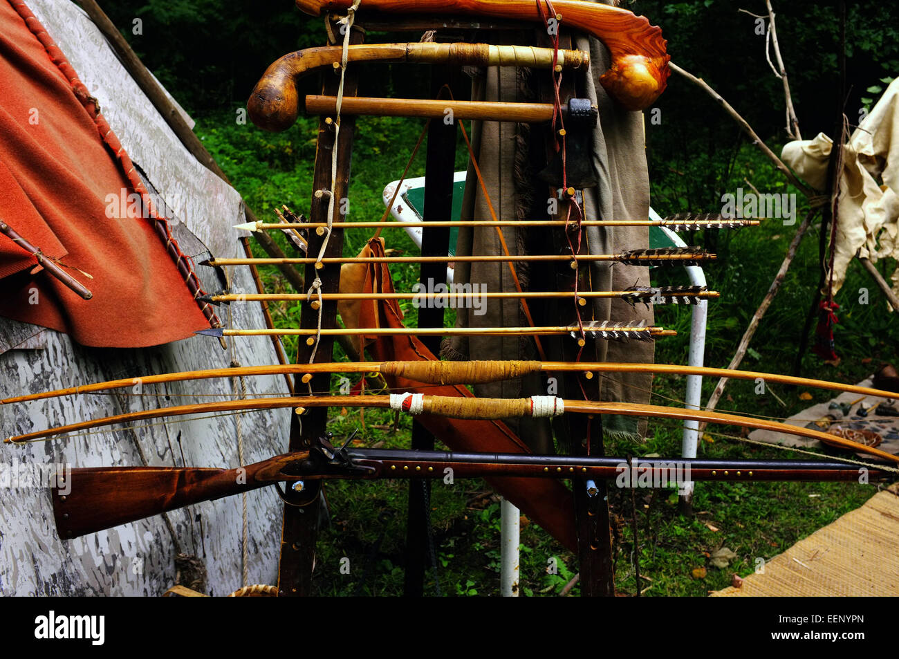 Antique North American hunting weapons on a rack Stock Photo - Alamy