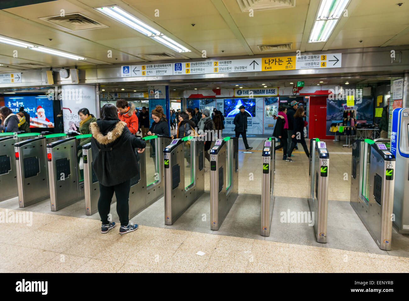 Local Seoulites swipe their metro cards at Gangnam Station on December ...