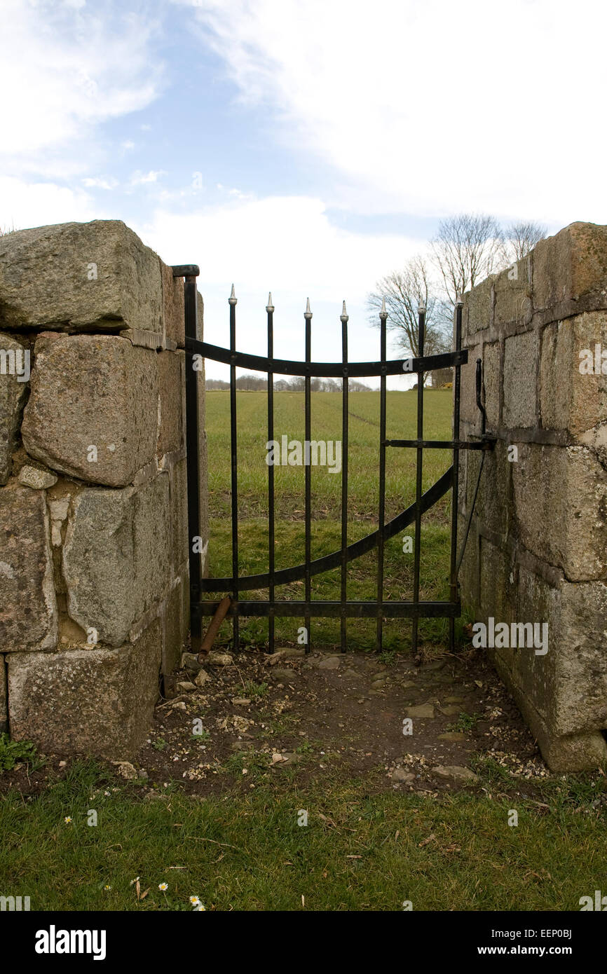 Small gate in a wall made of stone Stock Photo - Alamy