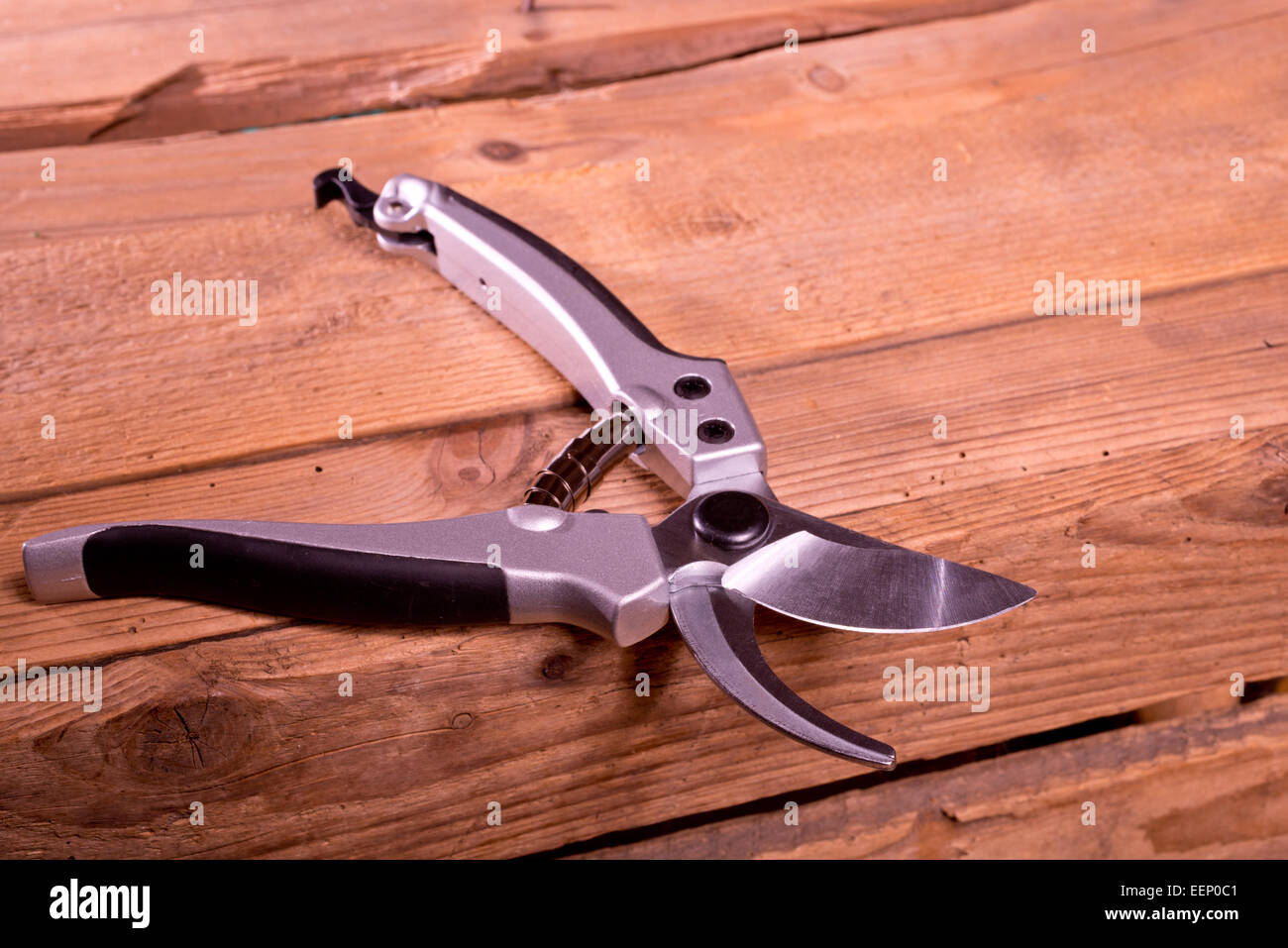 new pruning shears on the wooden table Stock Photo - Alamy