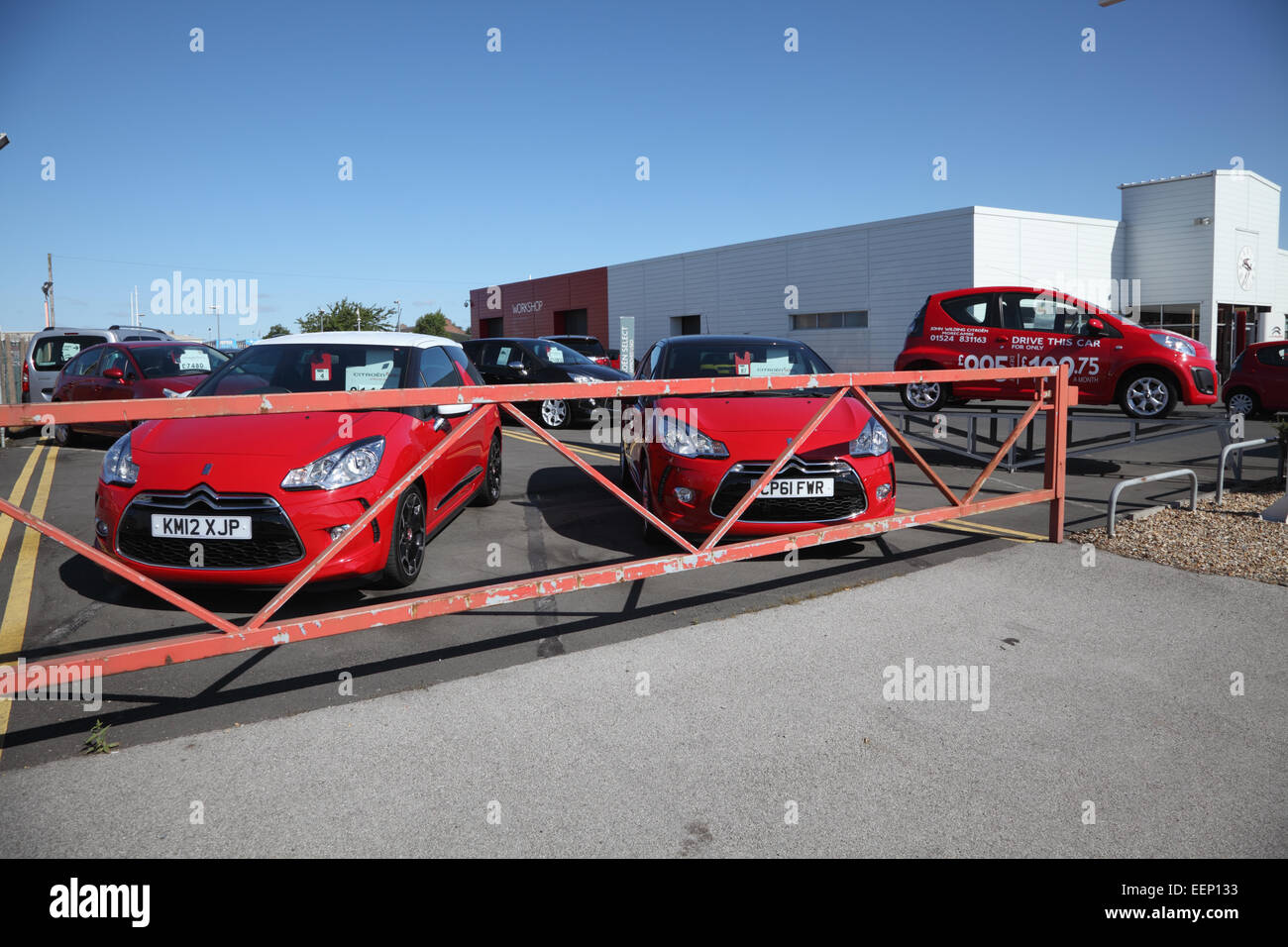 Cars for sale outside showroom Stock Photo - Alamy