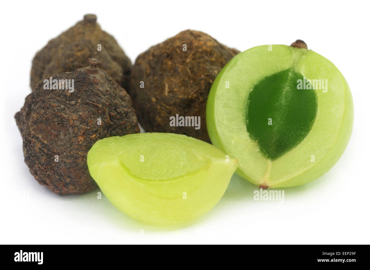 Amla fruits - dried and green over white background Stock Photo - Alamy