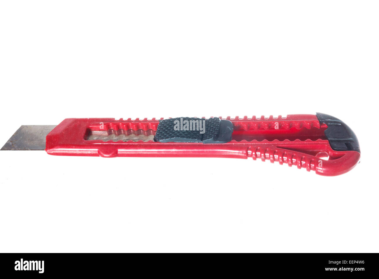 Red construction scalpel or cutter. Object isolated on white background ...