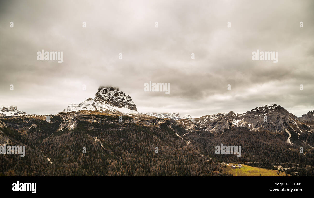 a mountain between the fog in the italian alps Stock Photo - Alamy