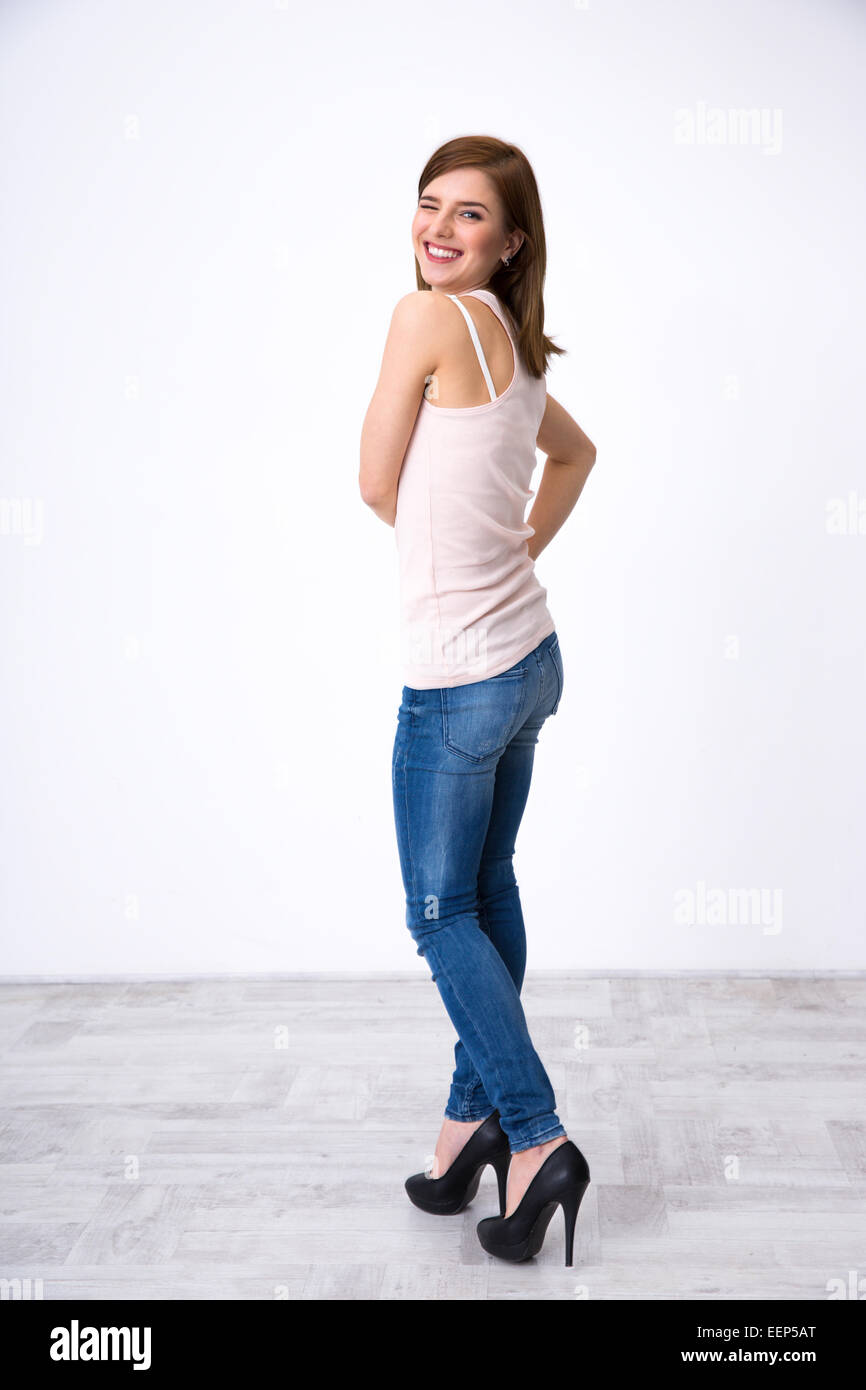 Back view portrait of a happy woman winking at camera Stock Photo - Alamy