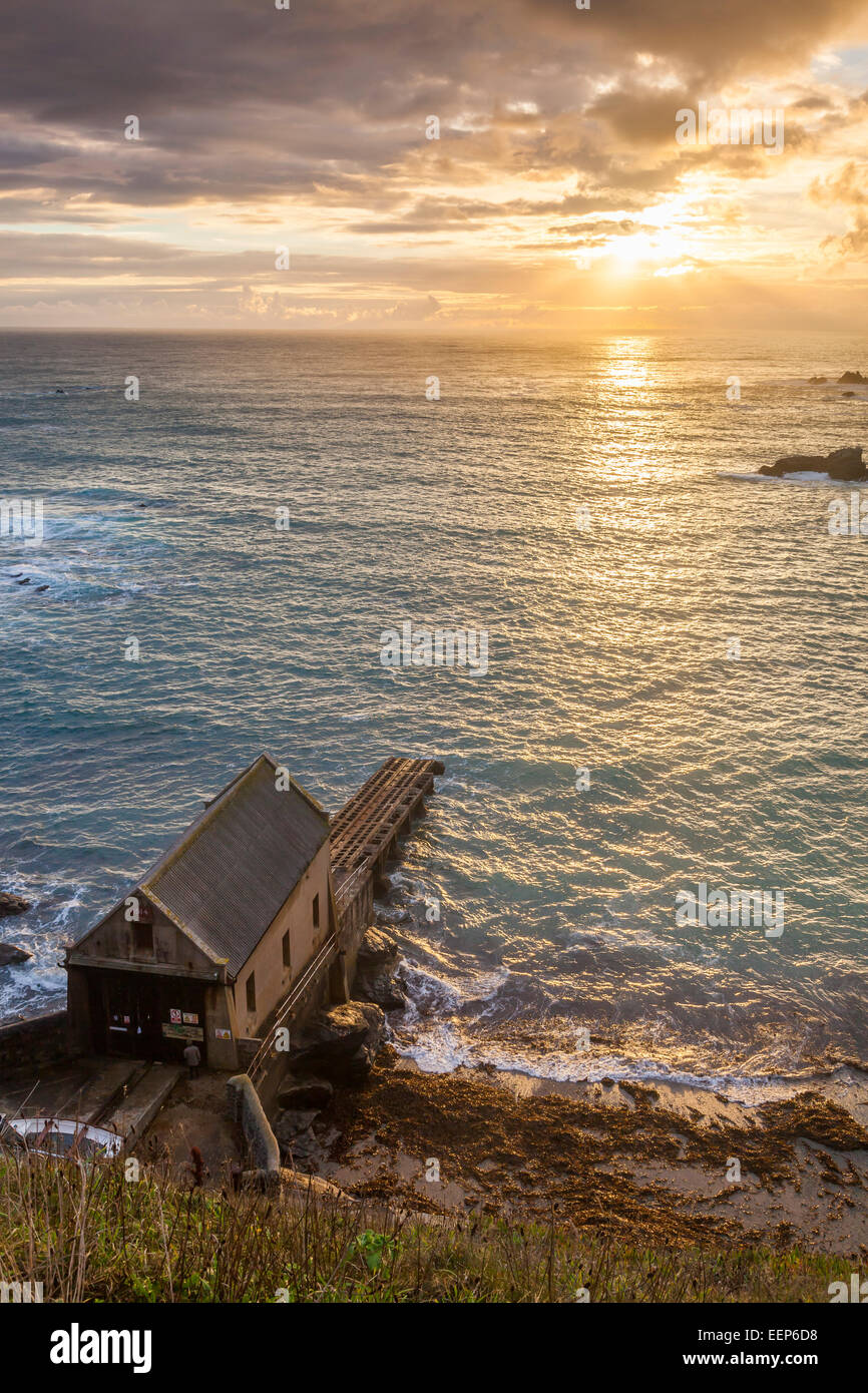 Dramtic sunset over Polpeor Cove at Lizard Point Cornwall England UK ...