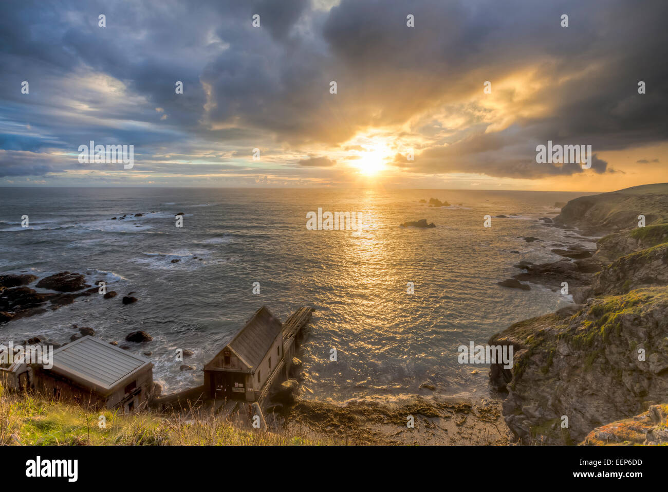 Dramtic sunset over Polpeor Cove at Lizard Point Cornwall England UK ...