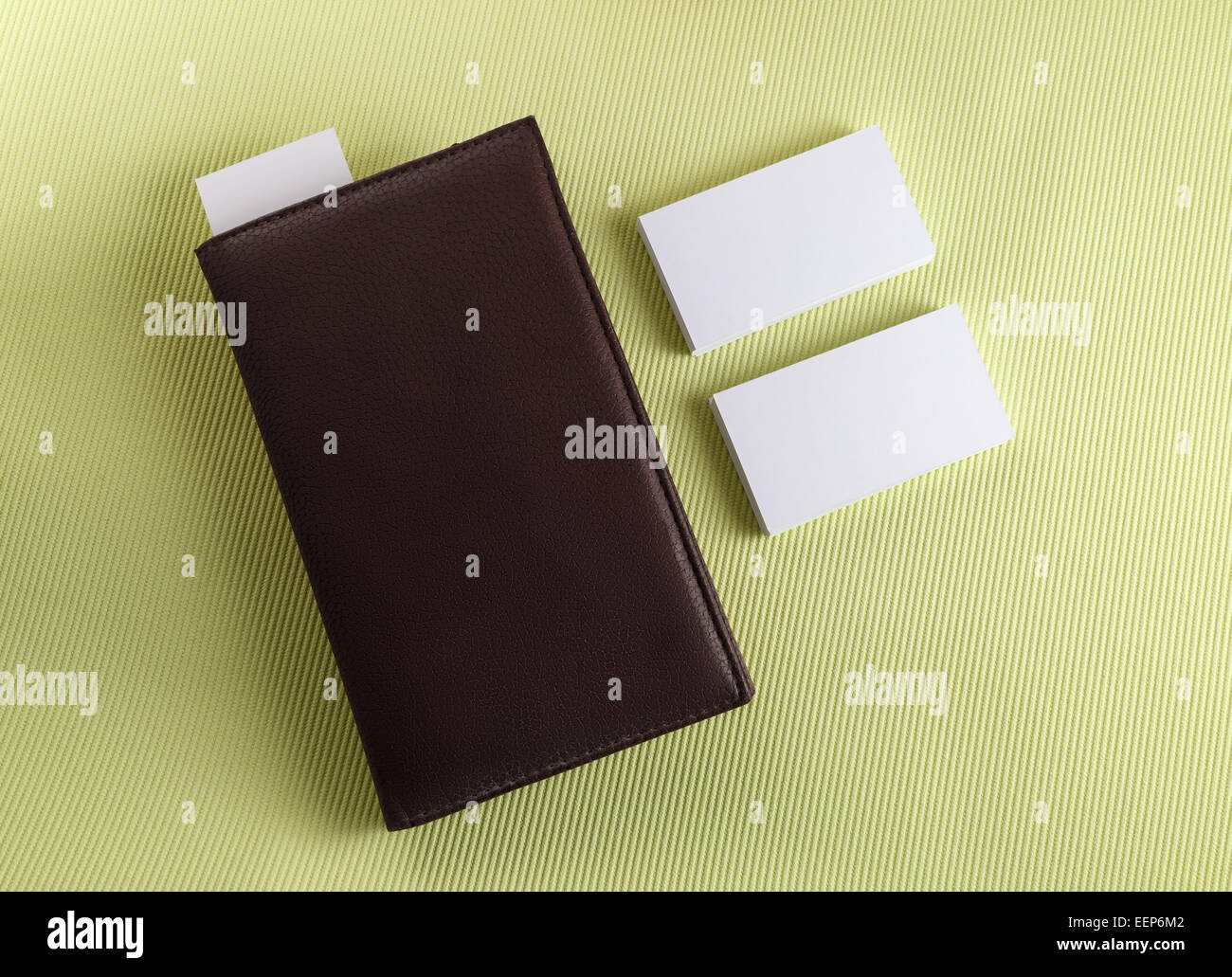 Notepad with business cards on a green background. Template for ...
