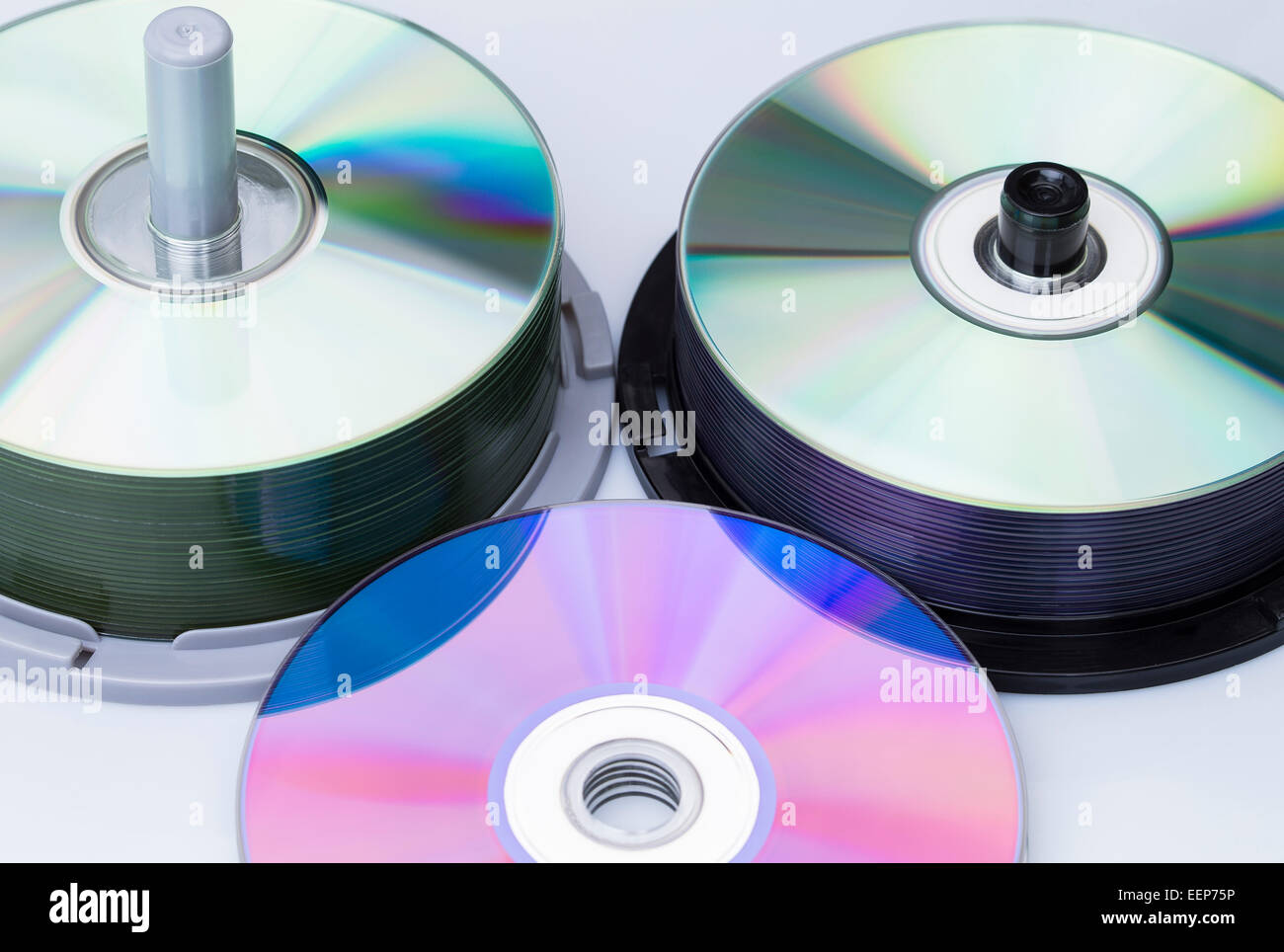 Image shows some stacks of compact disks isolated on white background ...