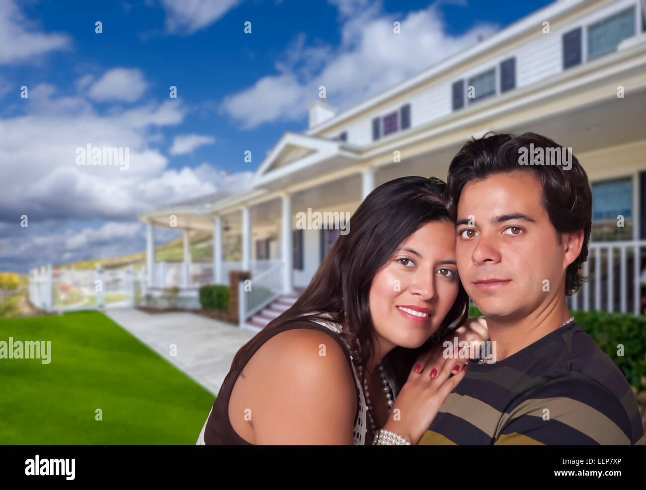 Young Happy Hispanic Young Couple in Front of Their New Home Stock ...